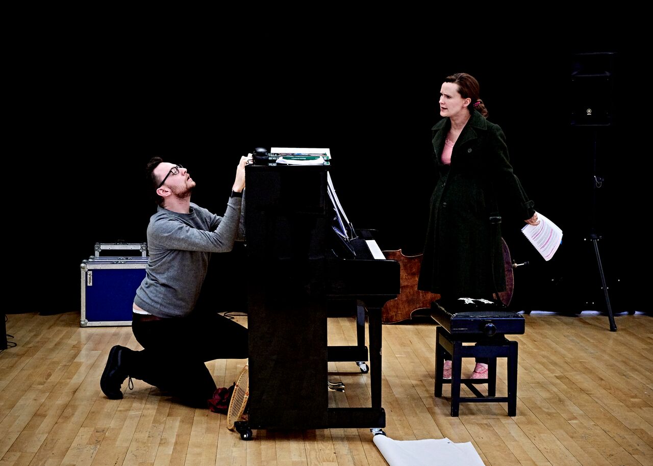 Sian and Tom hiding at piano – Sophie Rashbrook